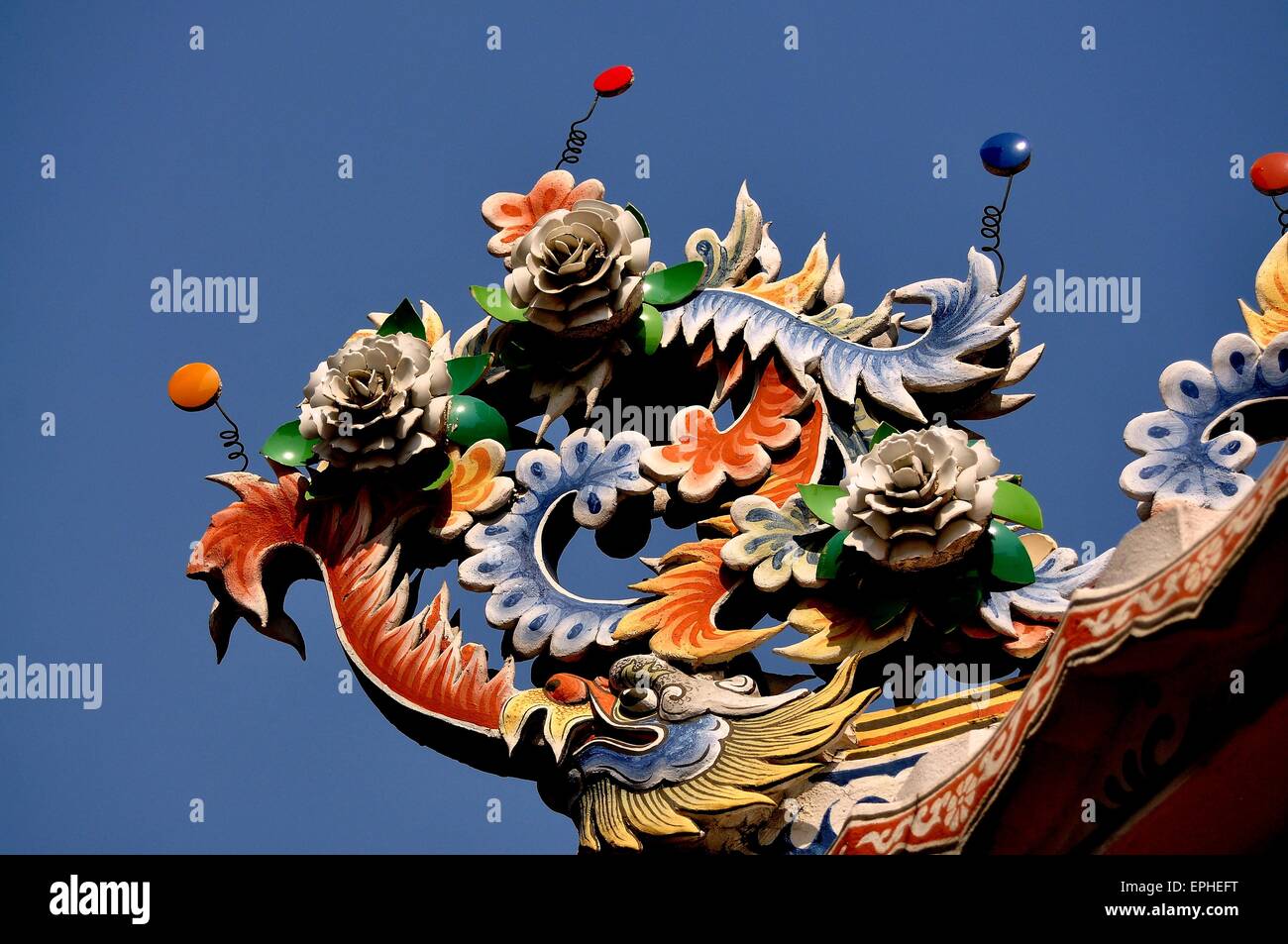 Bangkok, Thailand: Glazed Chinese porcelain rosettes and a dragon ...