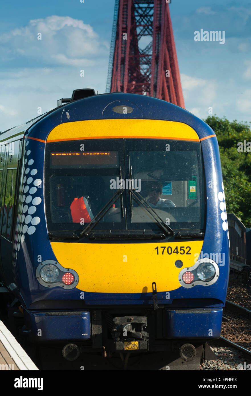 A Scotrail passenger train crosses the Forth Rail Bridge on the way ...