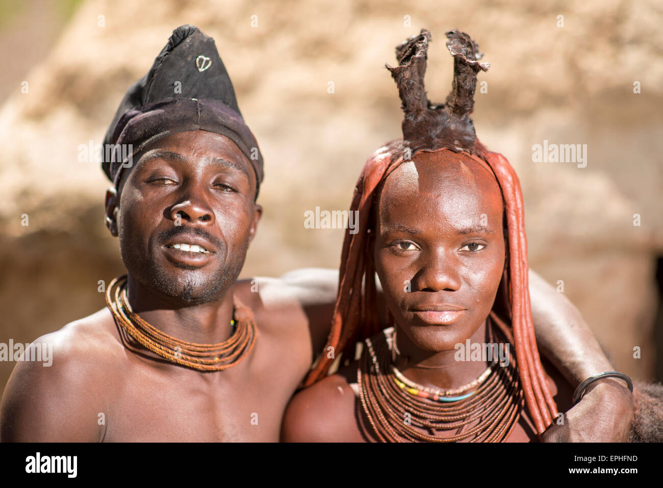 Africa, Namibia. Himba Tribe Village. Native man and woman posing Stock ...