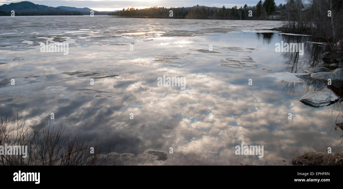 Clouds reflecting on lake water Stock Photo - Alamy