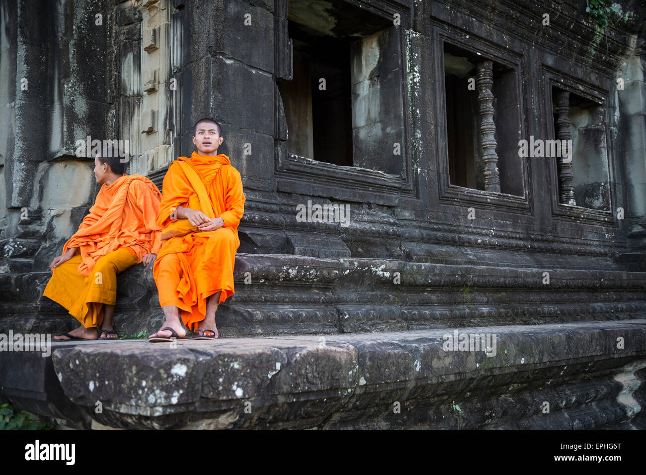 Novice monk sitting by temple hi-res stock photography and images - Alamy