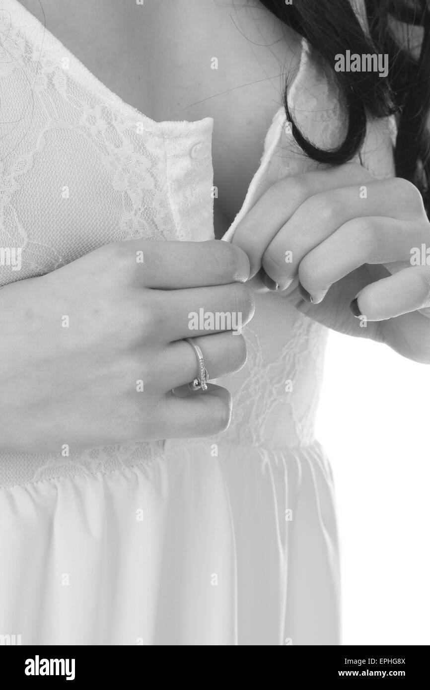 Fingers of a beautiful young woman fastening her dress Stock Photo - Alamy