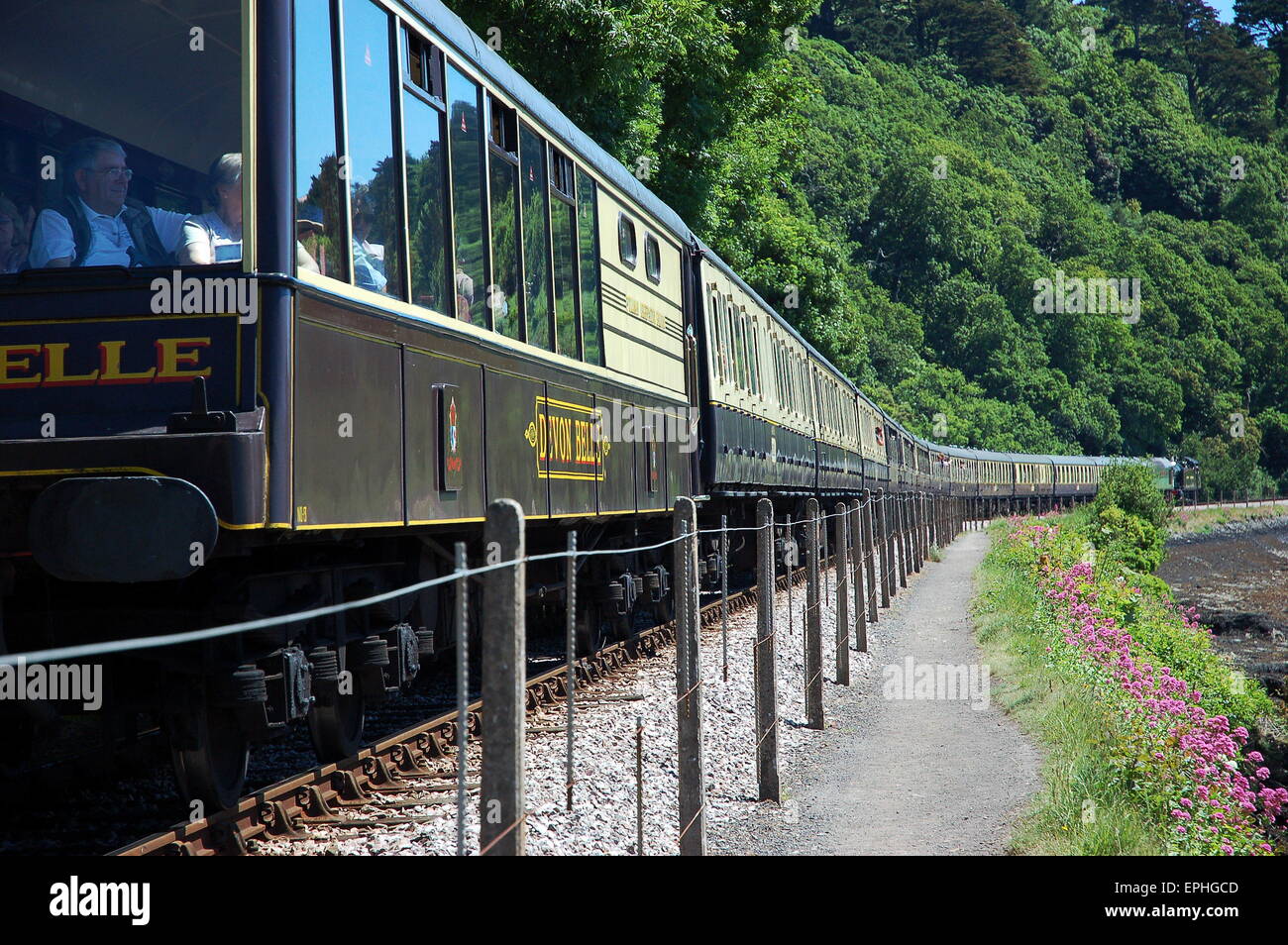 Passengers in the observation carriage enjoy the view as a train ...