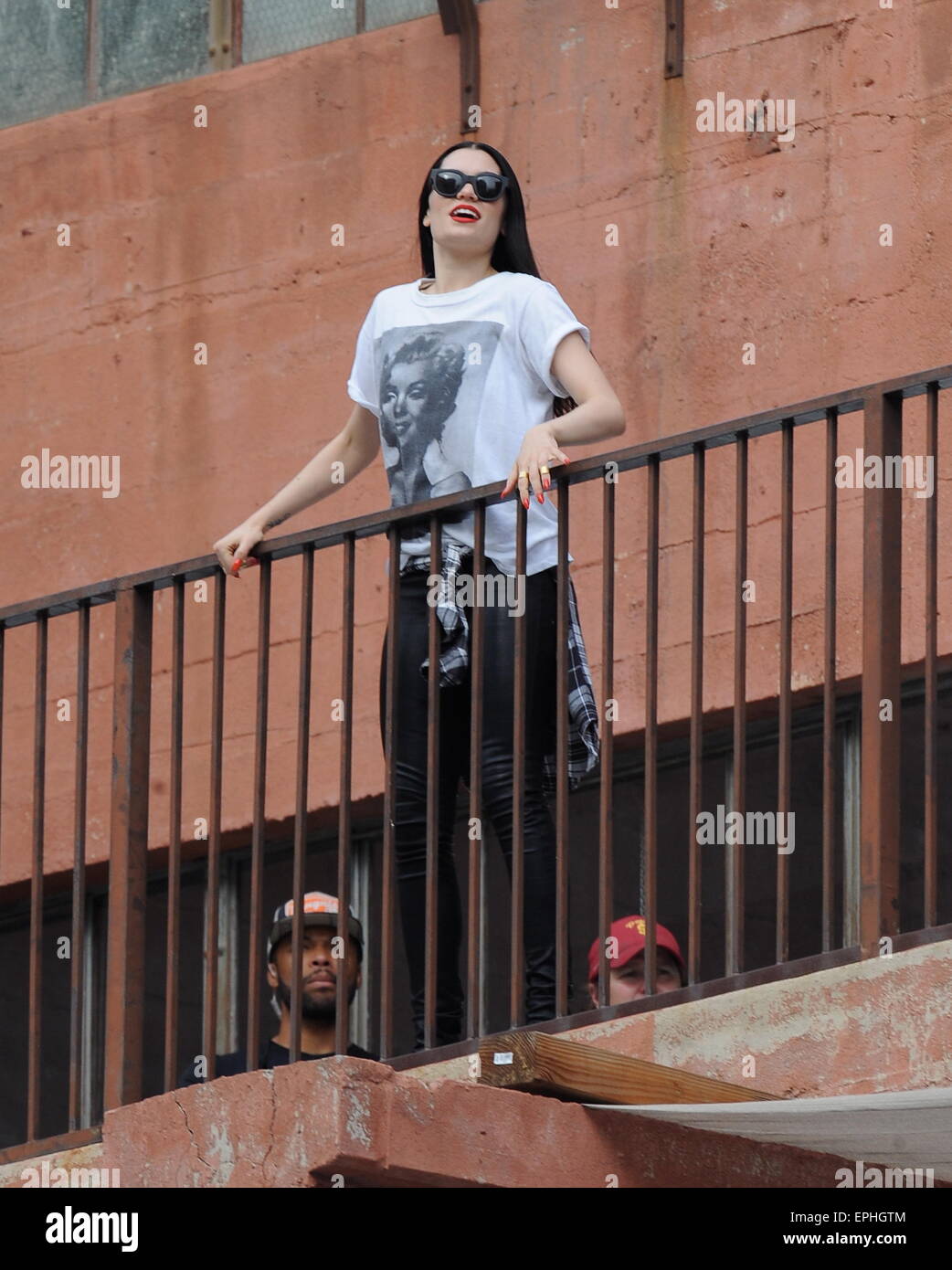 UK singer Jesse J waves at fans on a balcony while filming her latest ...