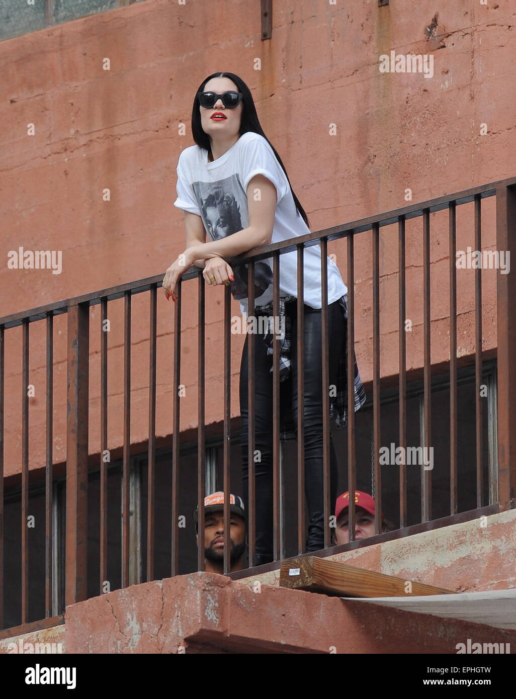 UK singer Jesse J waves at fans on a balcony while filming her latest ...