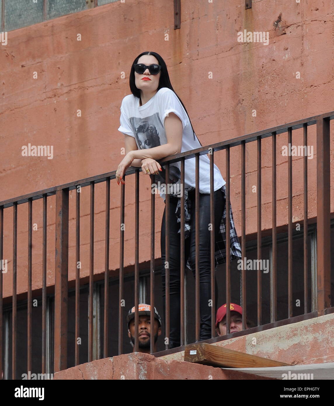 UK singer Jesse J waves at fans on a balcony while filming her latest ...