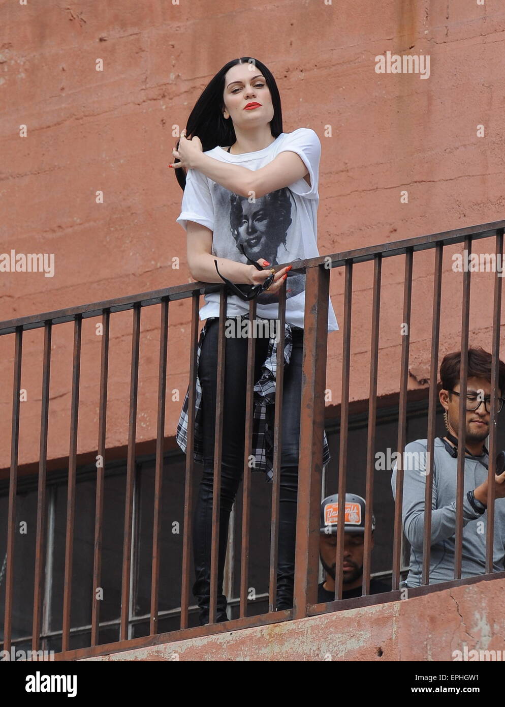 UK singer Jesse J waves at fans on a balcony while filming her latest ...