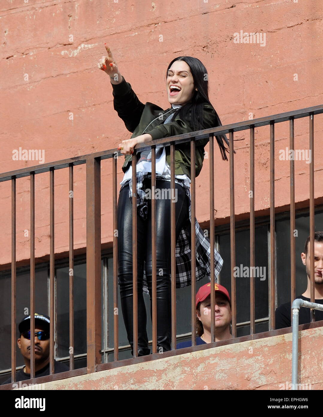 UK singer Jesse J waves at fans on a balcony while filming her latest ...
