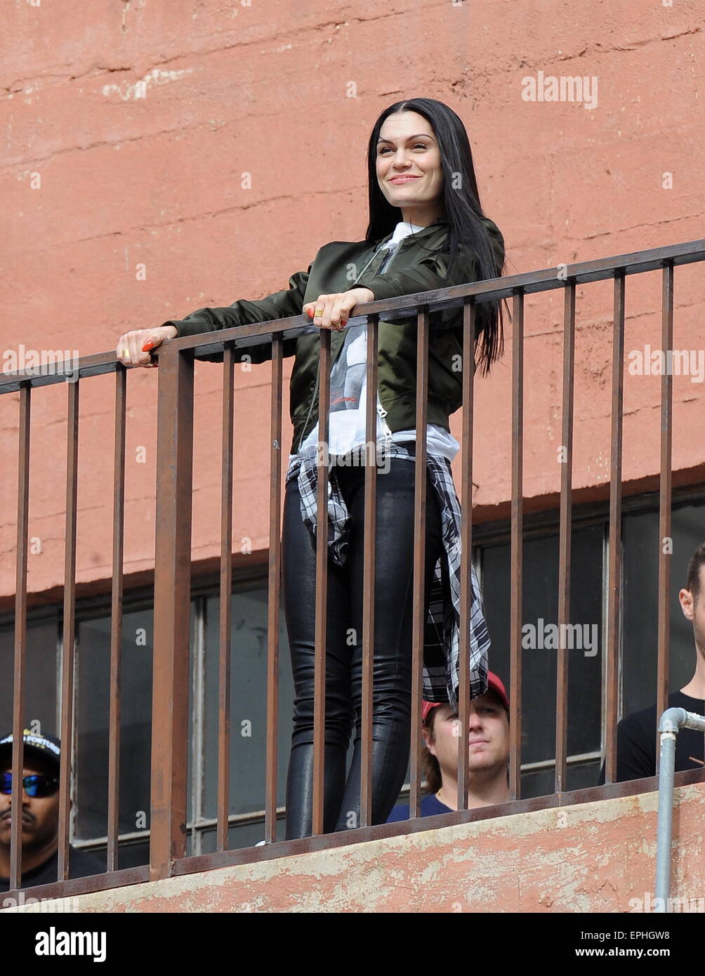 UK singer Jesse J waves at fans on a balcony while filming her latest ...