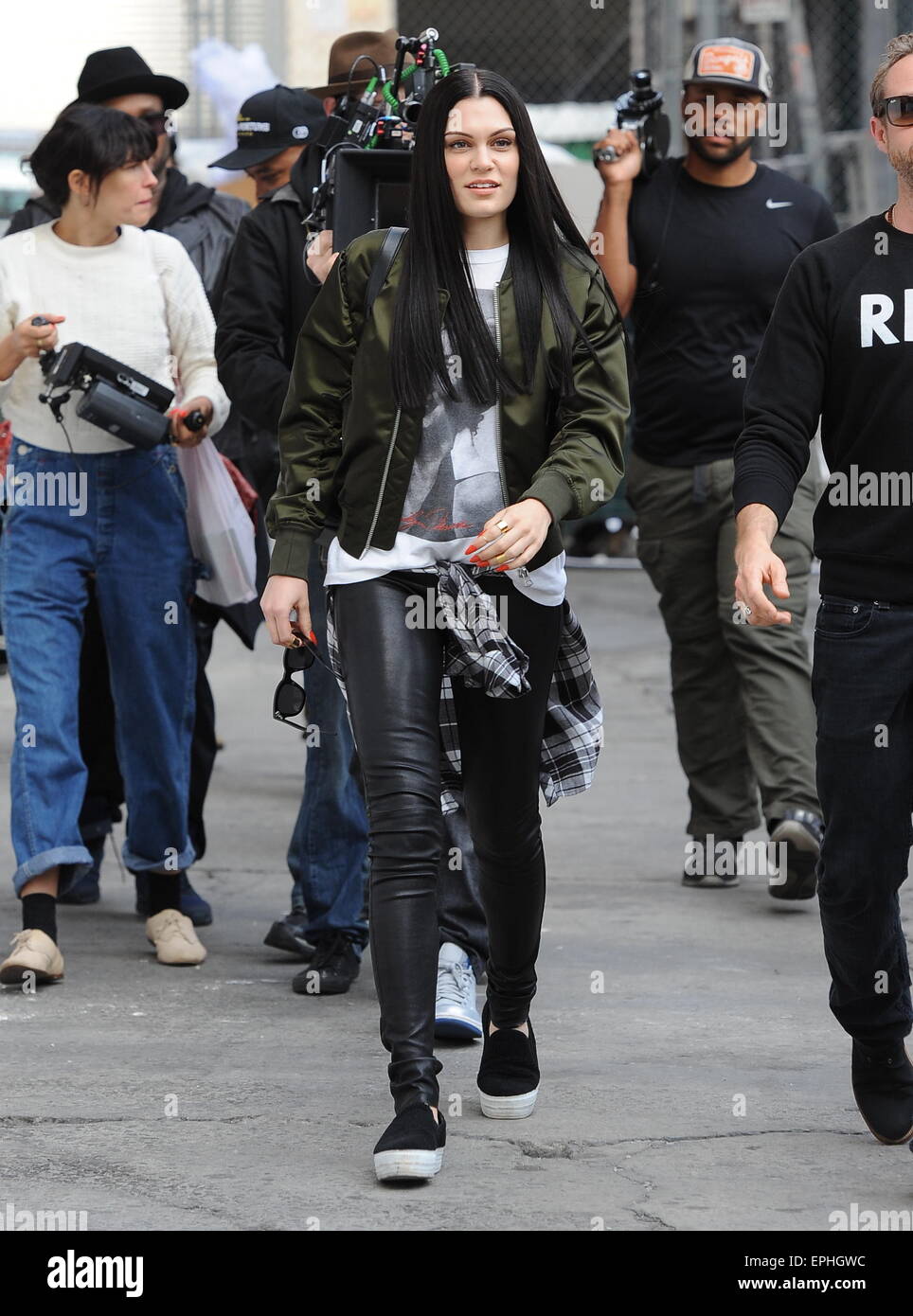 UK singer Jesse J waves at fans on a balcony while filming her latest ...