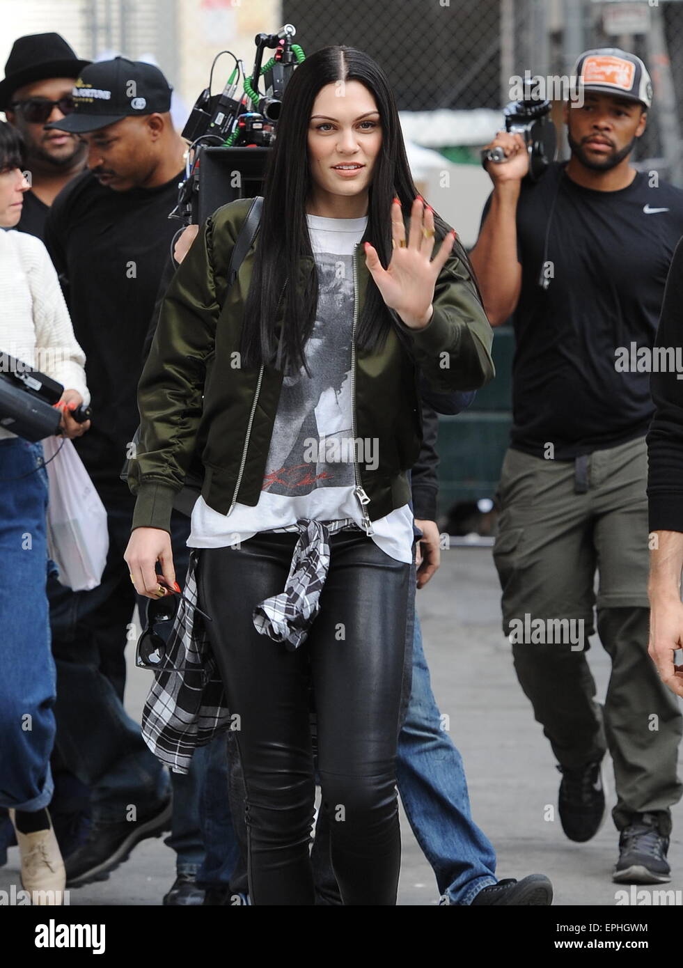 UK singer Jesse J waves at fans on a balcony while filming her latest ...