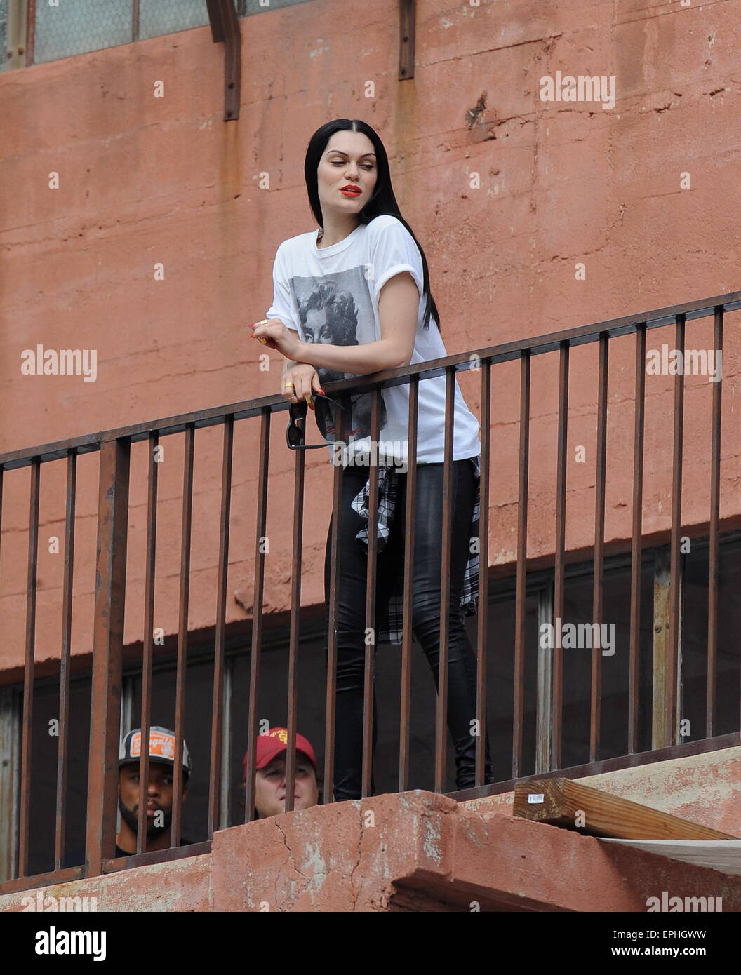 UK singer Jesse J waves at fans on a balcony while filming her latest ...