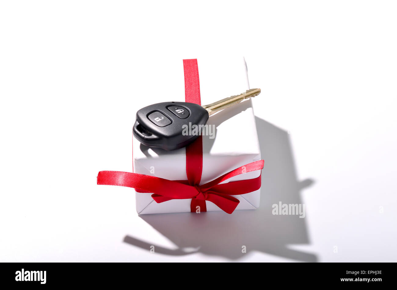 car key and gift box isolated on white background Stock Photo - Alamy