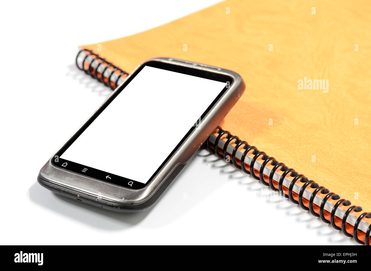 smartphone with orange note book on a white background Stock Photo - Alamy