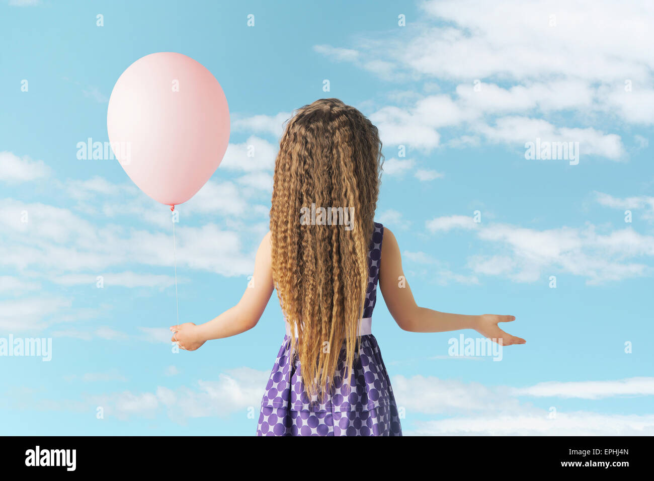 Cute little girl with a balloon Stock Photo - Alamy