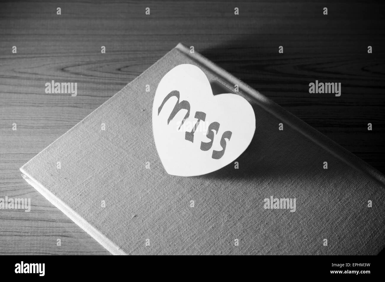 black and white paper heart write miss word Stock Photo - Alamy