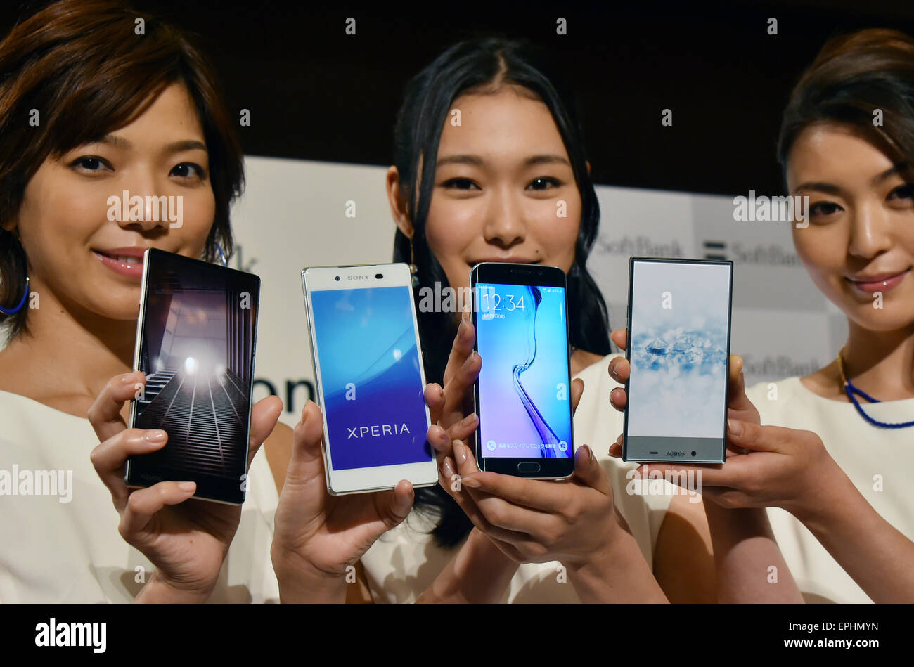 Tokyo, Japan. 19th May, 2015. Models poses with a new lineup of mobile ...