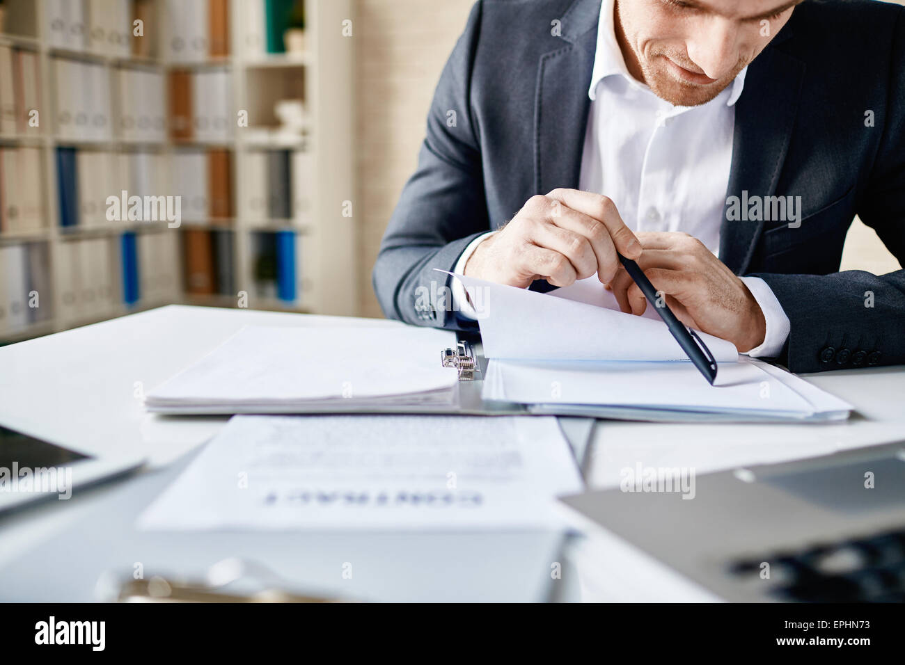 Man reading documents hand up hi-res stock photography and images - Alamy
