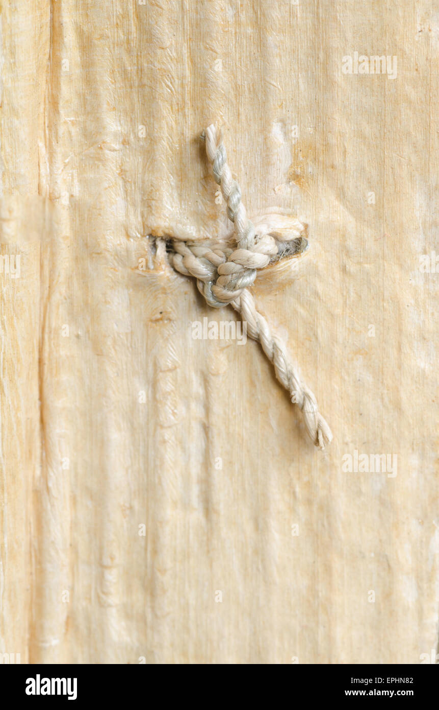 twine knot on paper background Stock Photo - Alamy