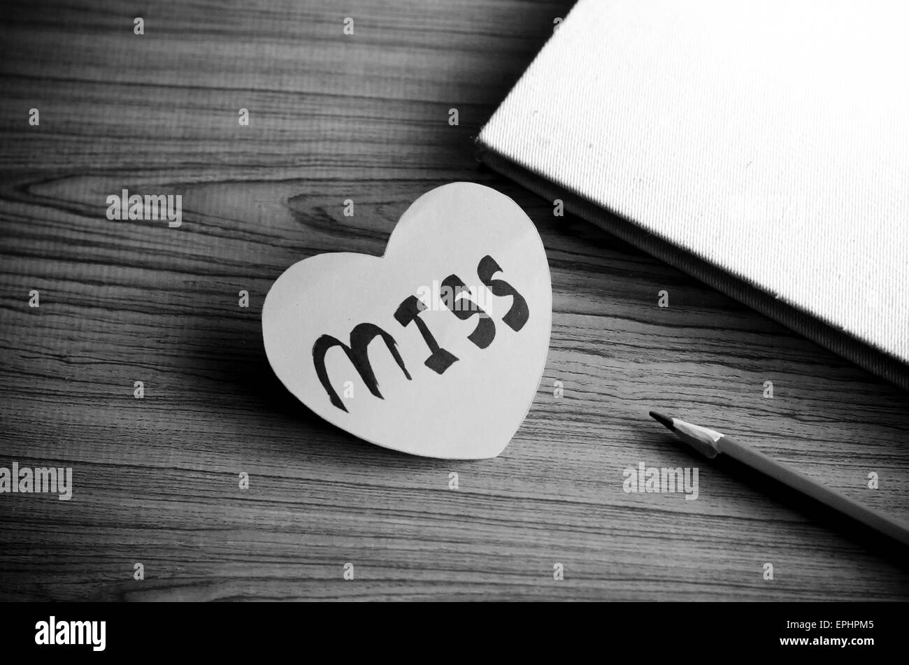 black and white paper heart write miss word word word Stock Photo - Alamy