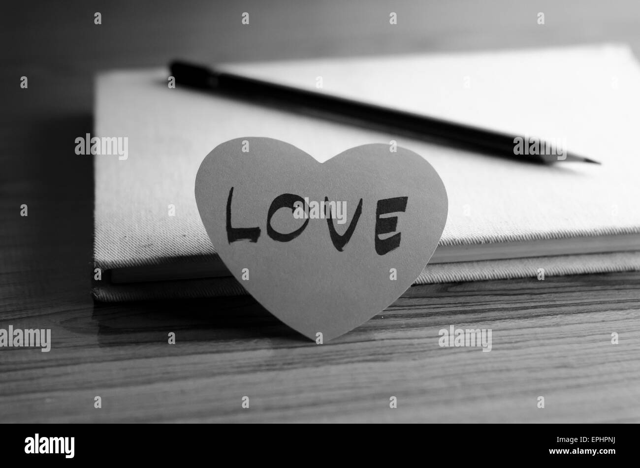 black and white paper heart write love word word Stock Photo - Alamy