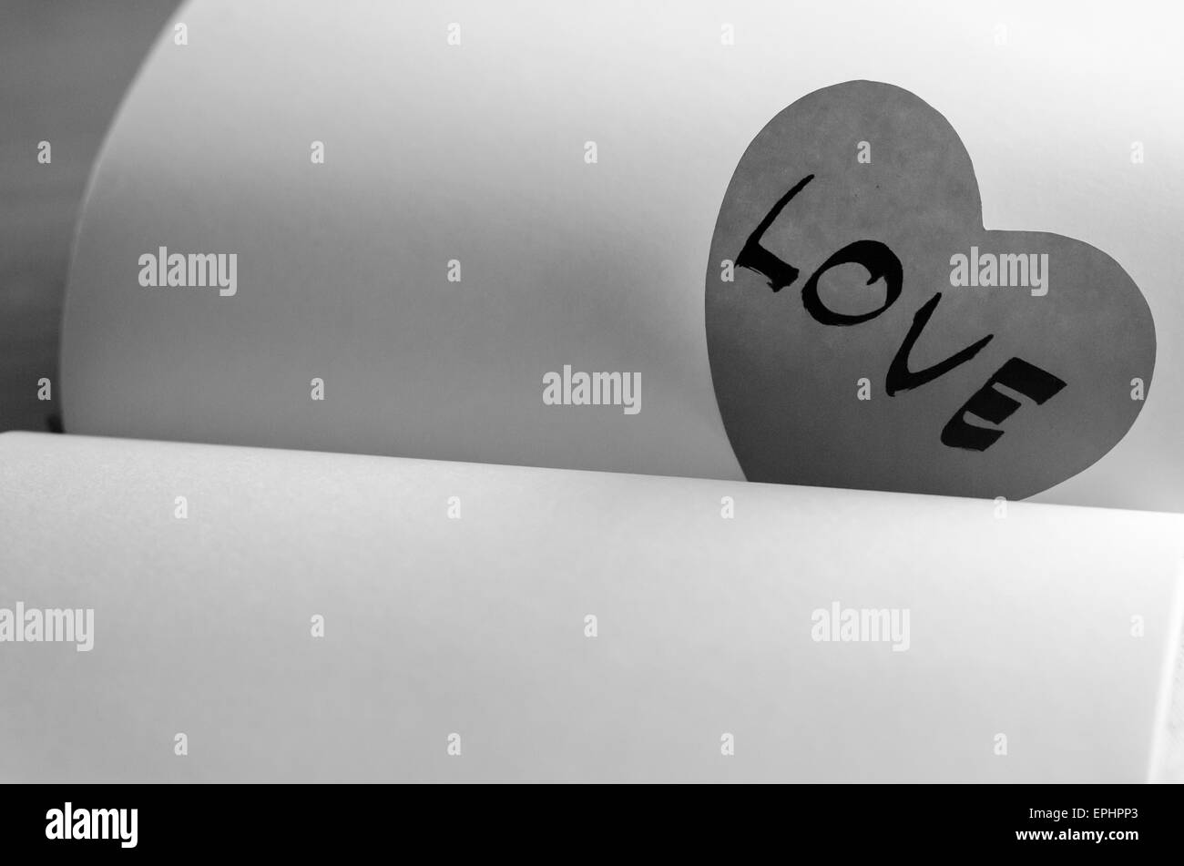 black and white paper heart write love word word Stock Photo - Alamy