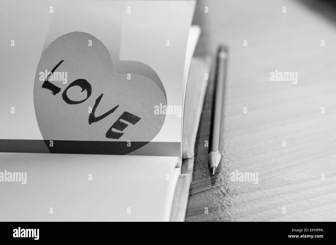 black and white paper heart write love word word Stock Photo - Alamy