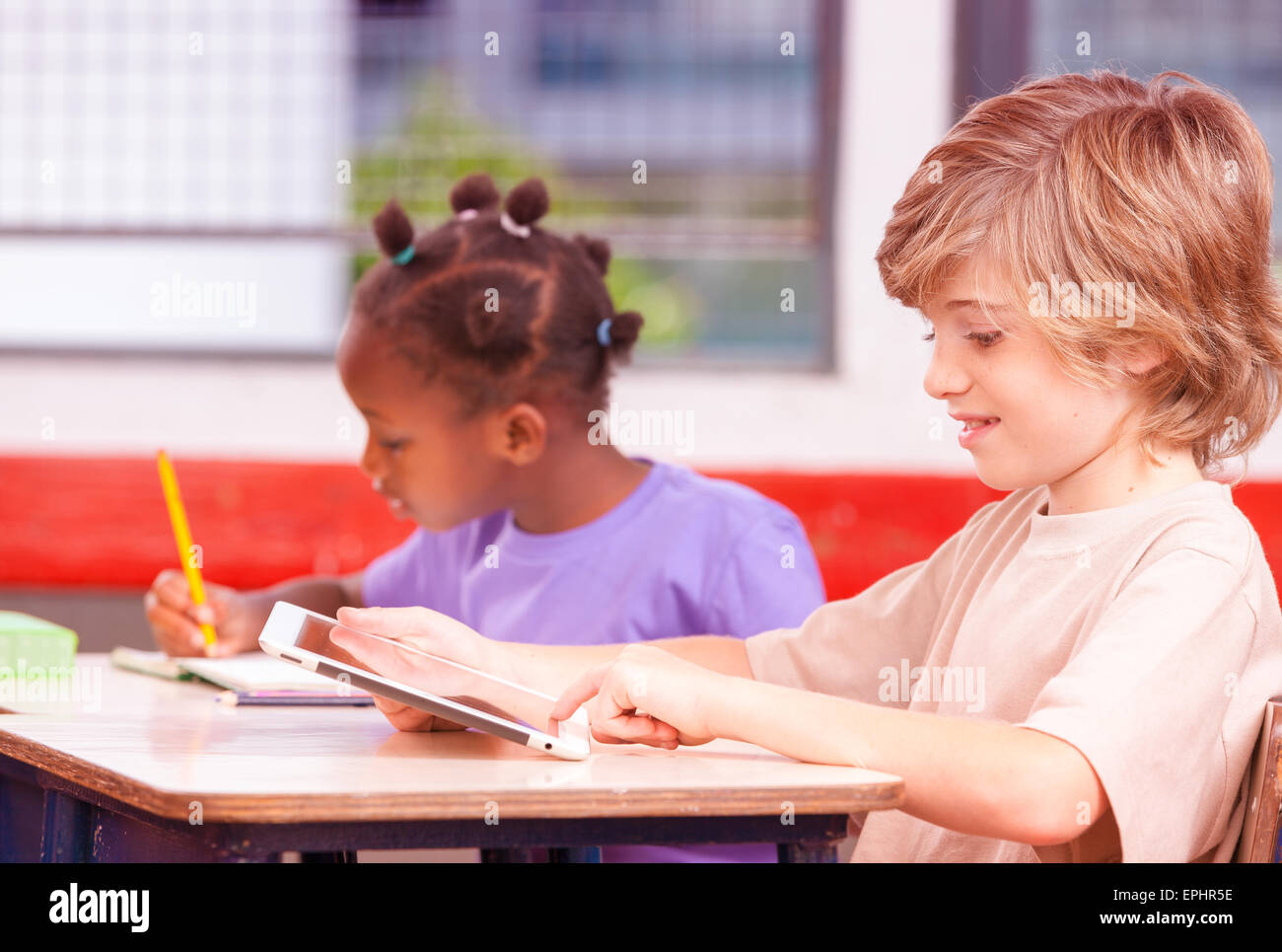 Happy school scene. Elementary class Stock Photo - Alamy