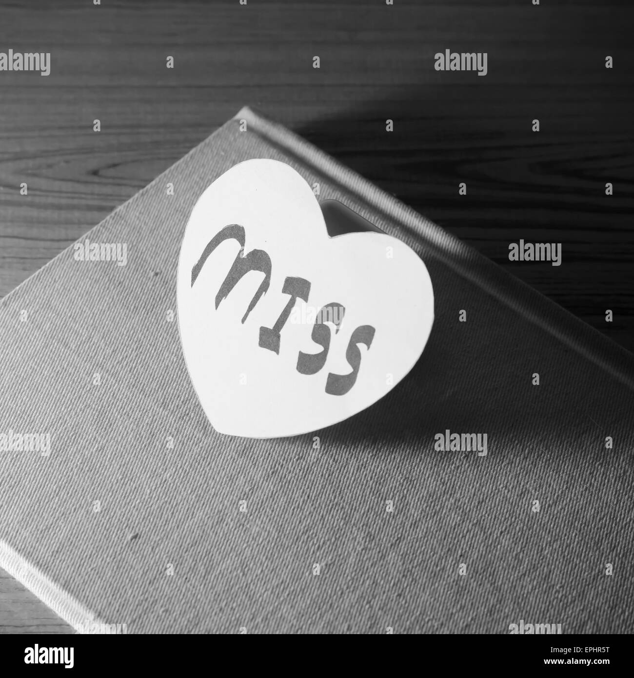 black and white paper heart write miss word Stock Photo - Alamy