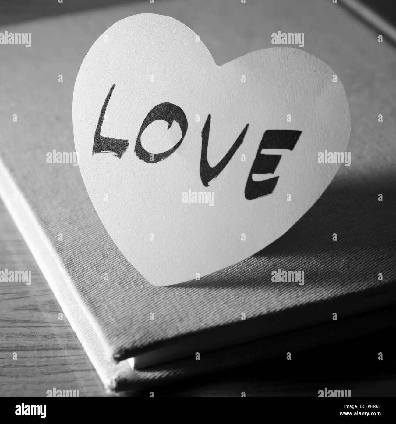 black and white paper heart write love word word Stock Photo - Alamy