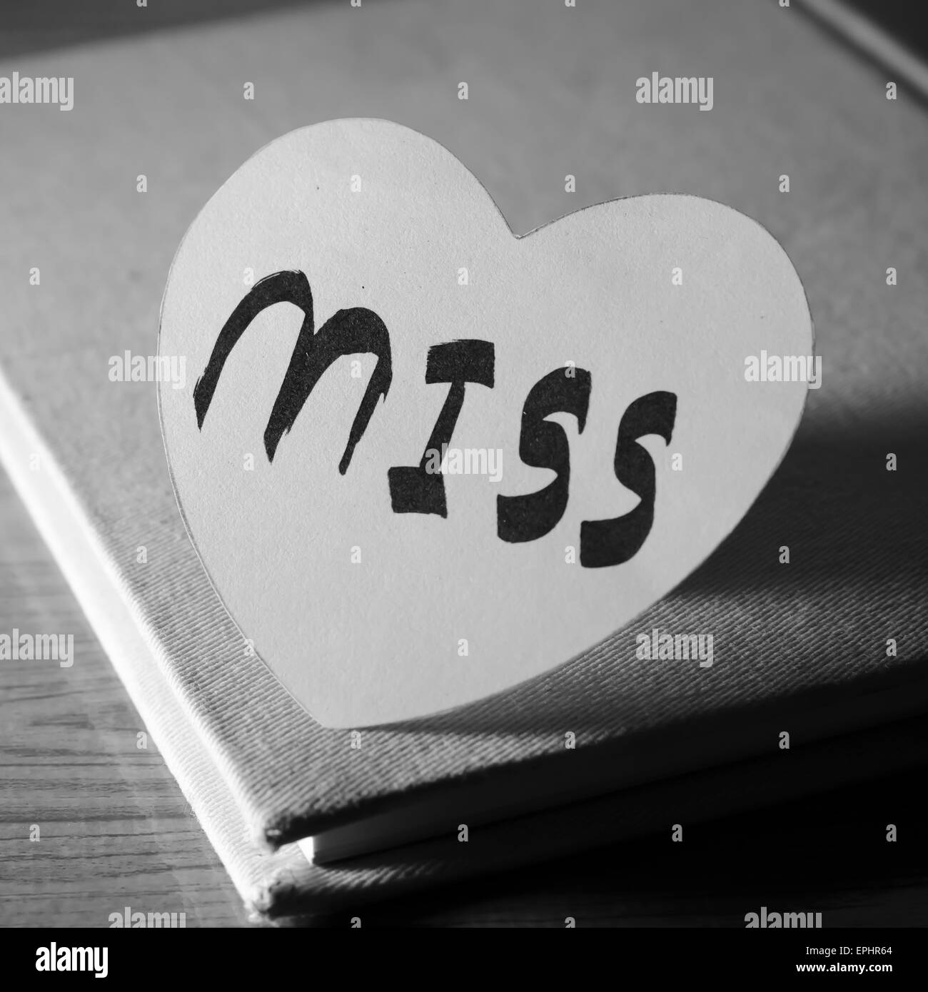black and white paper heart write miss word Stock Photo - Alamy