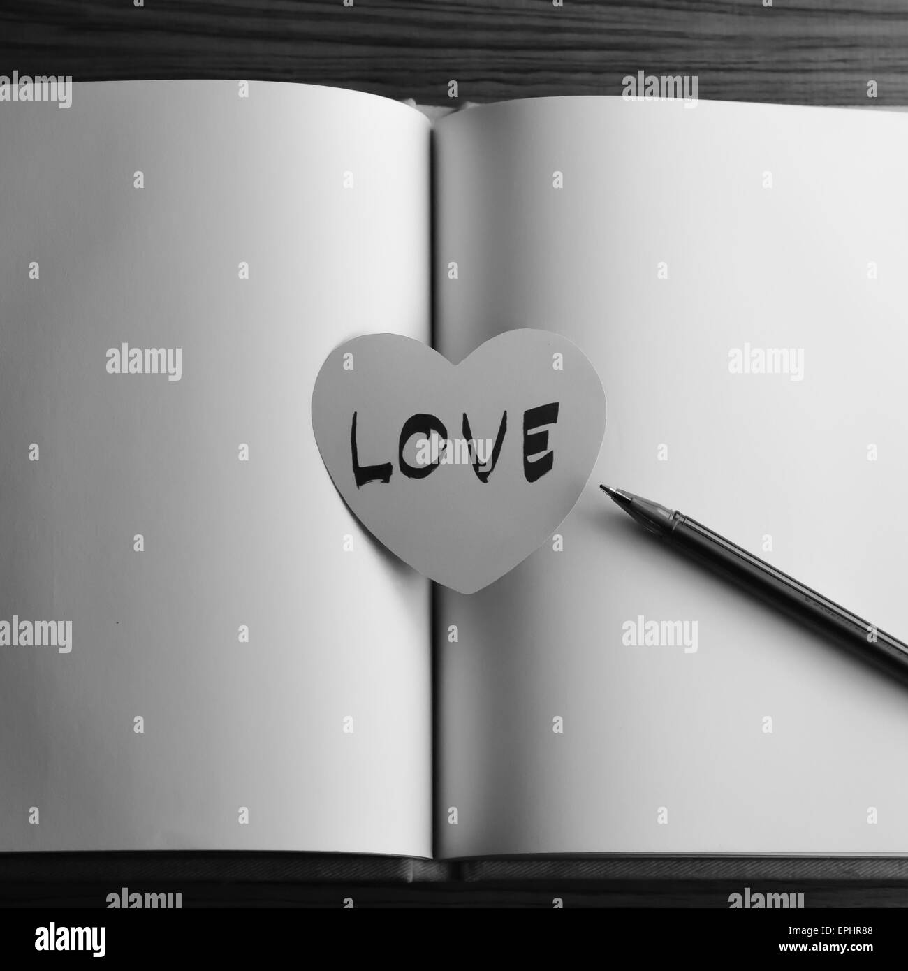 black and white paper heart write love word word Stock Photo - Alamy