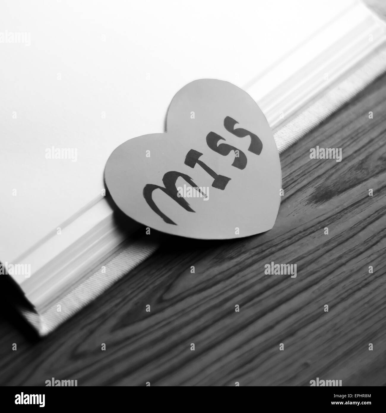 black and white paper heart write miss word word word Stock Photo - Alamy