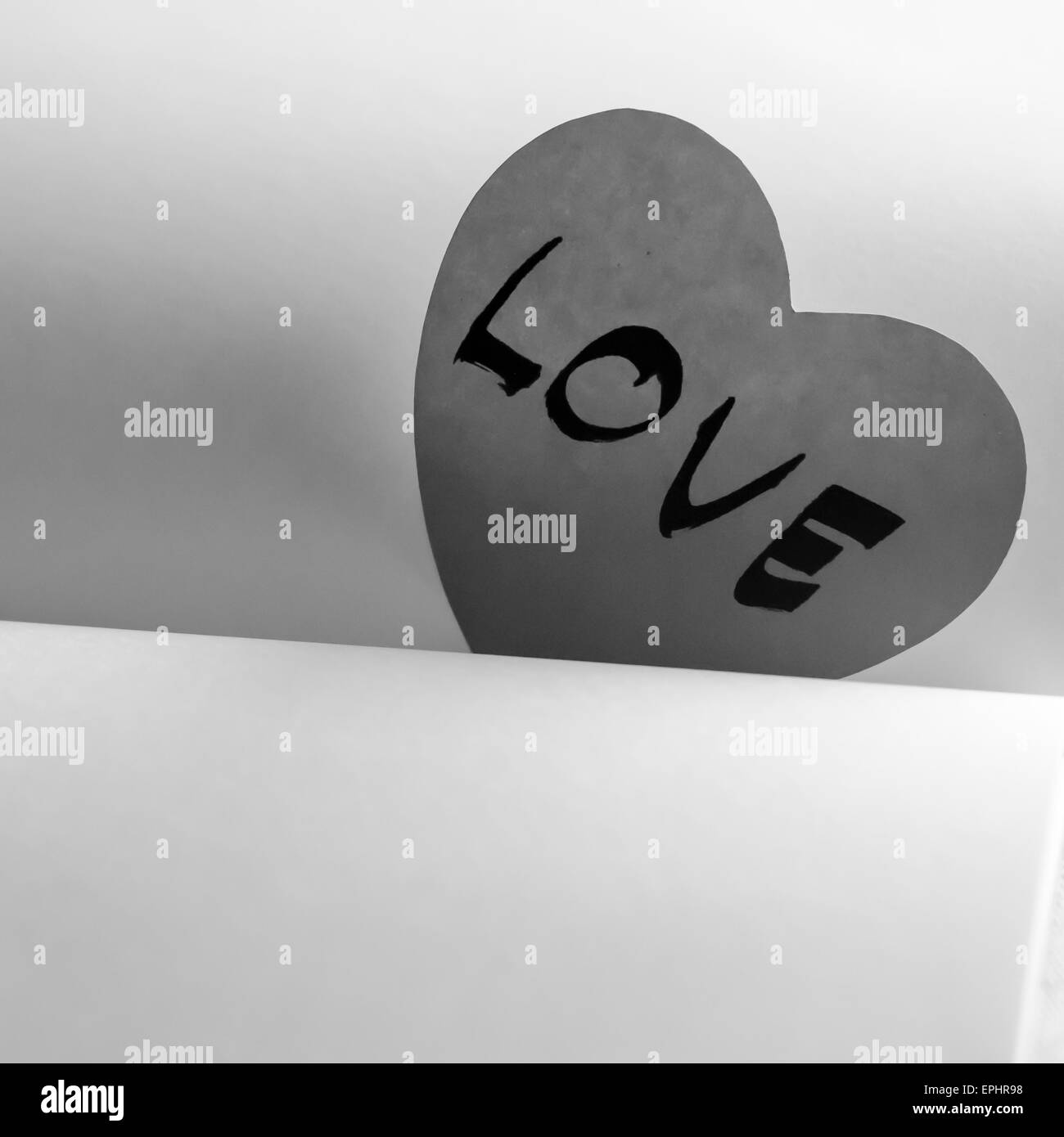 black and white paper heart write love word word Stock Photo - Alamy