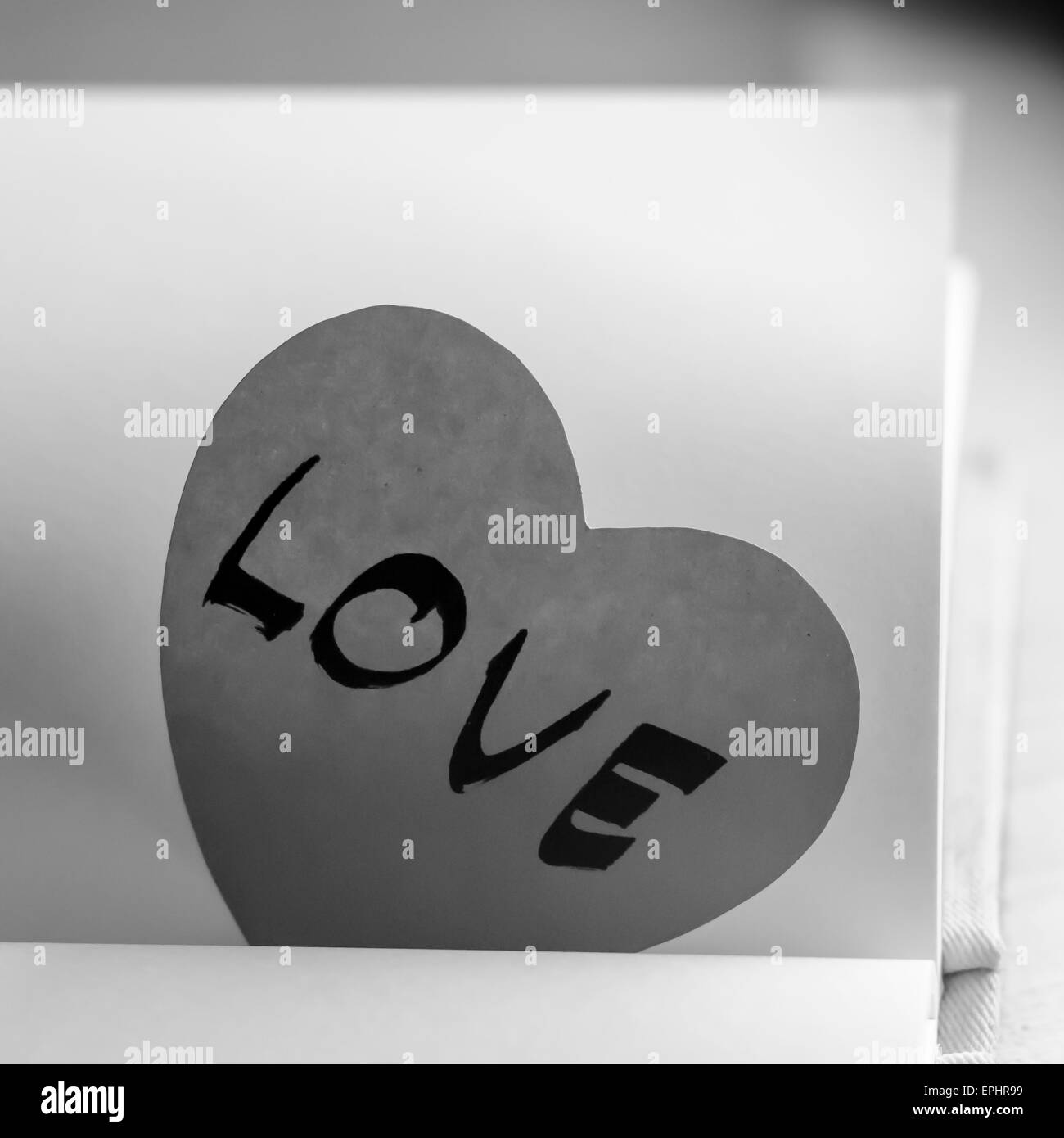 black and white paper heart write love word word Stock Photo - Alamy
