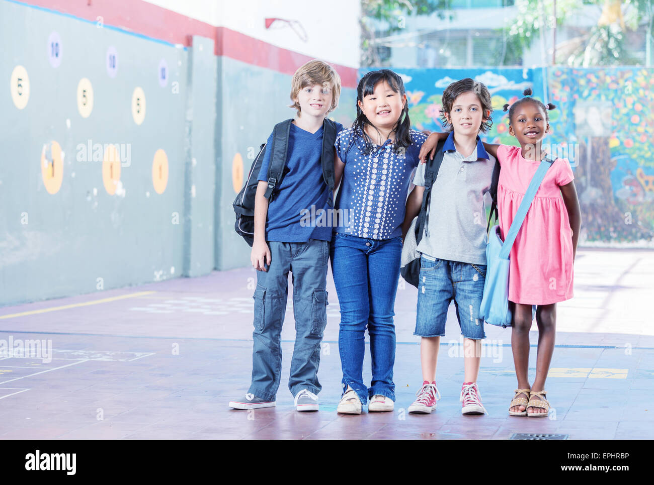 Schoolchildren embracing happy. Multi cultural racial classroom Stock ...