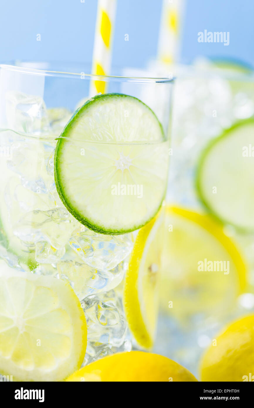 Infused water with fresh citrus fruits and ice Stock Photo - Alamy