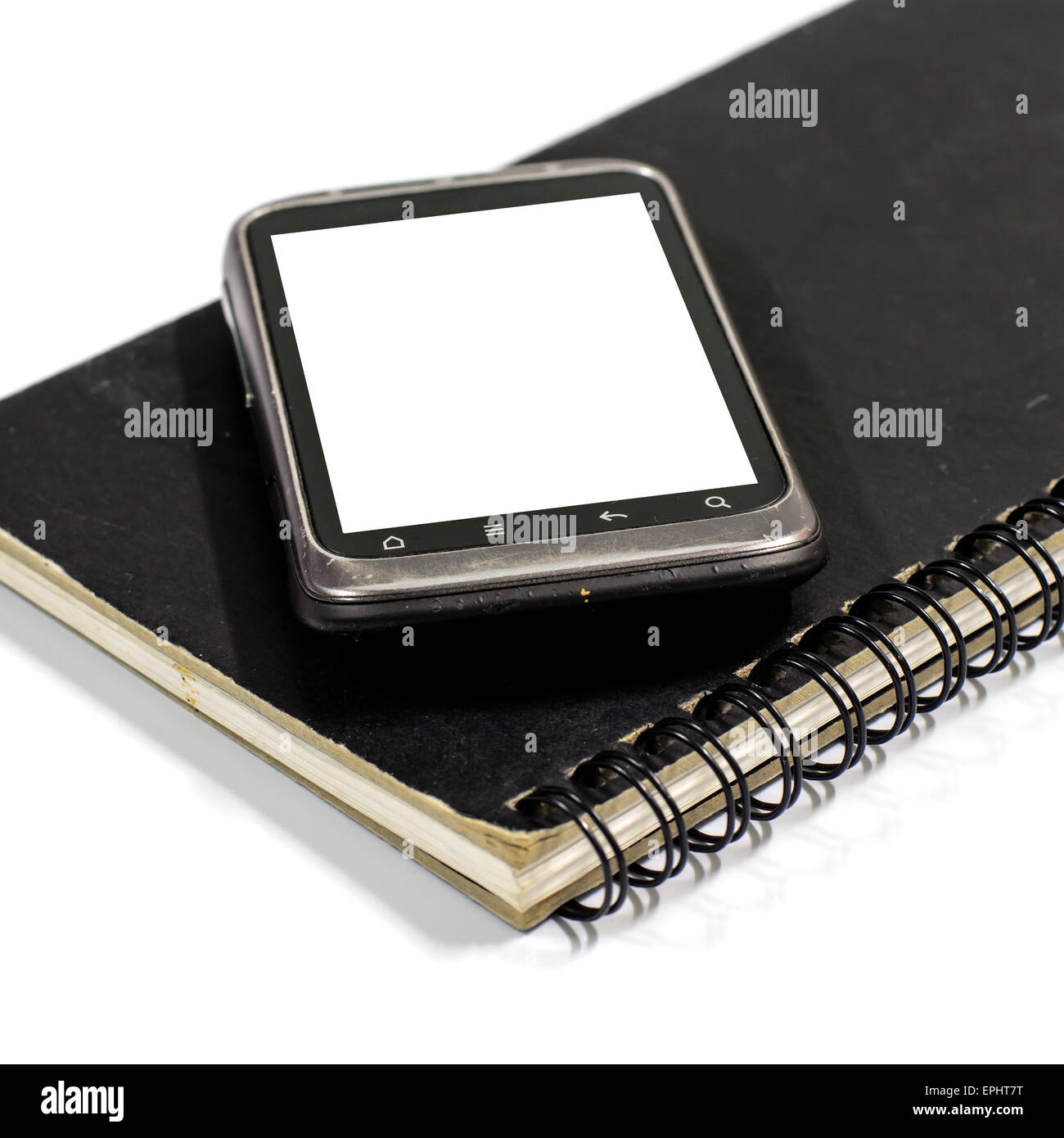 smartphone on note book on a white background Stock Photo - Alamy