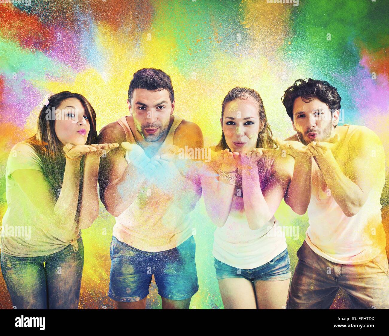 Happy friends playing powder paint hi-res stock photography and images ...