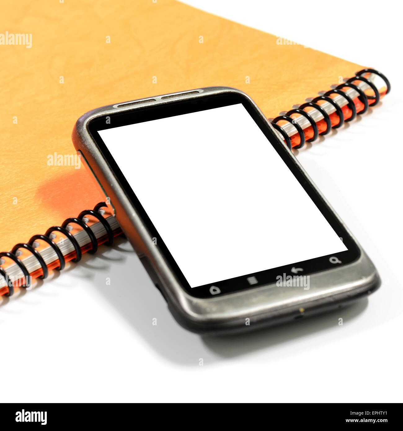 smartphone with orange note book on a white background Stock Photo - Alamy