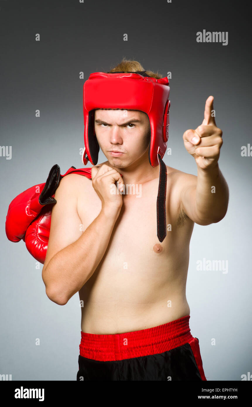 Angry boxer against grey background Stock Photo - Alamy