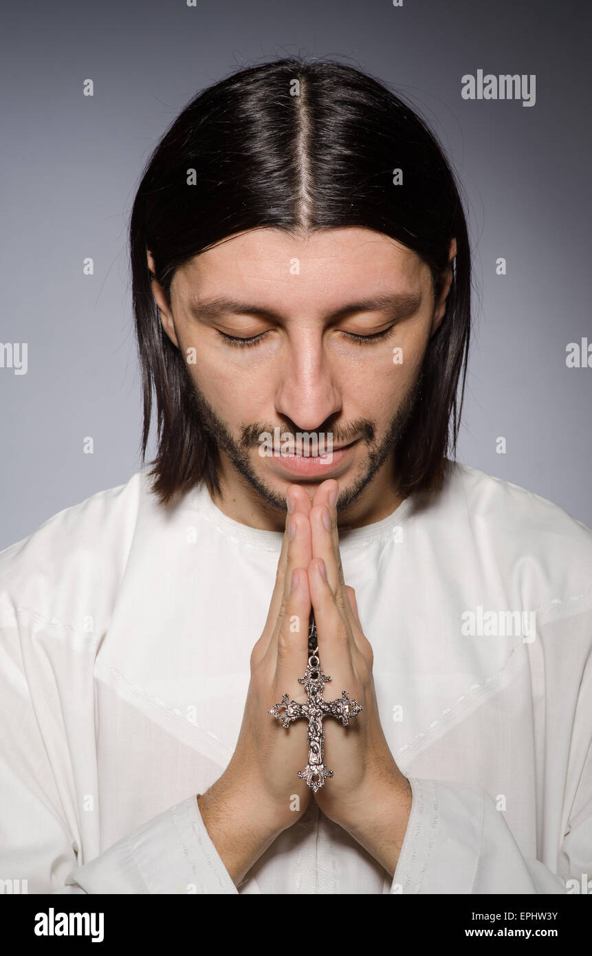 Priest man in religious concept Stock Photo - Alamy