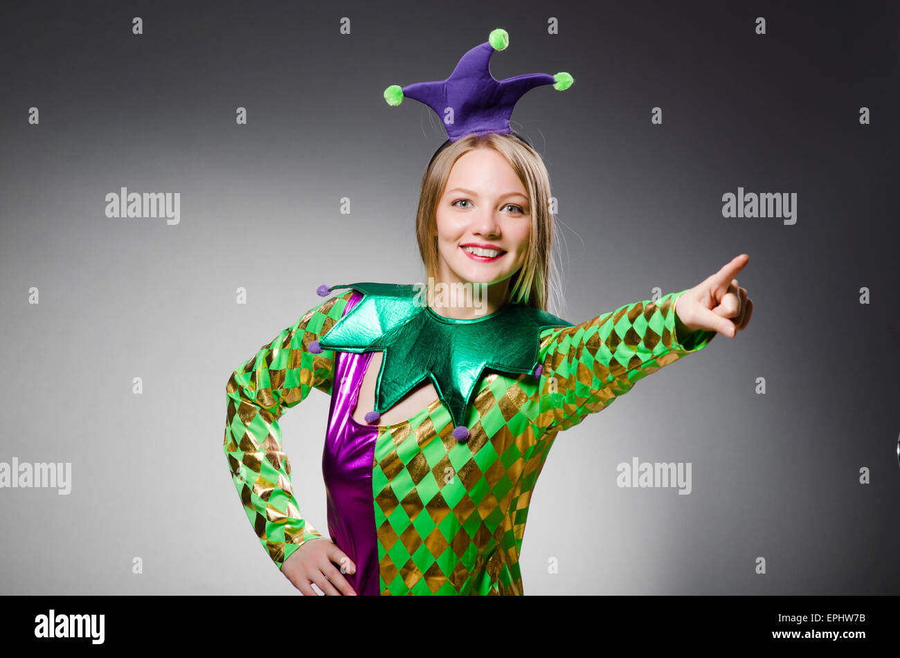 Funny clown in colourful costume Stock Photo - Alamy