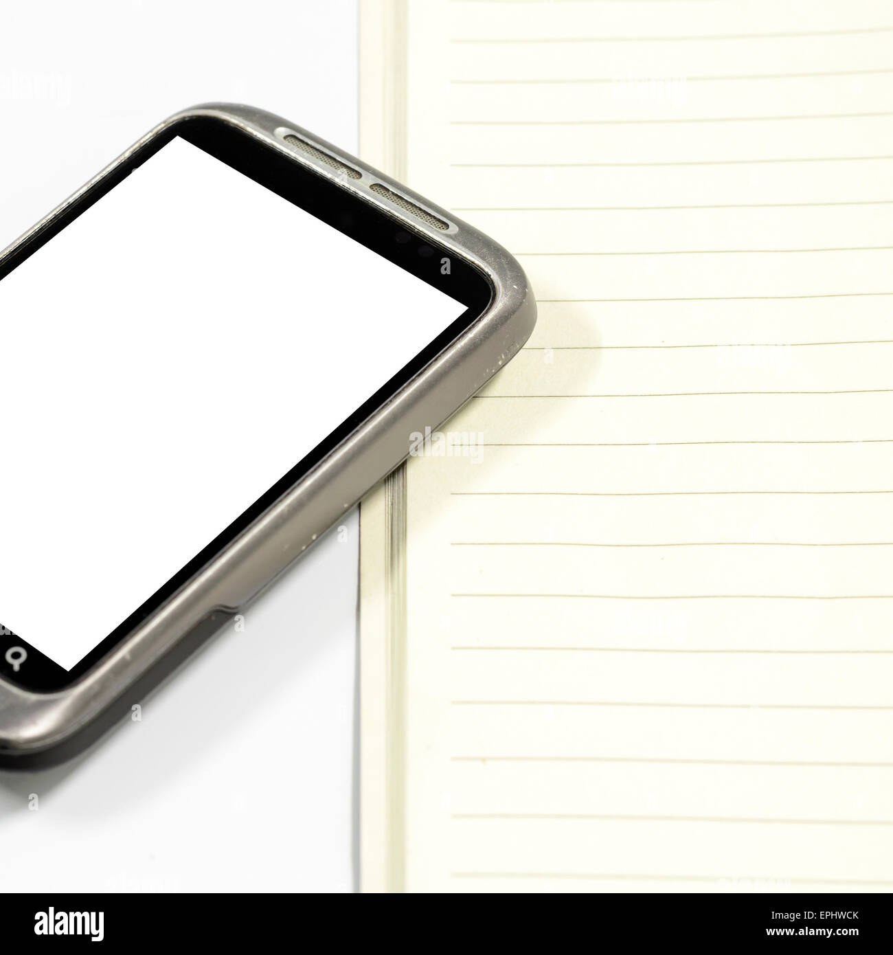 smartphone with note book on a white background Stock Photo - Alamy