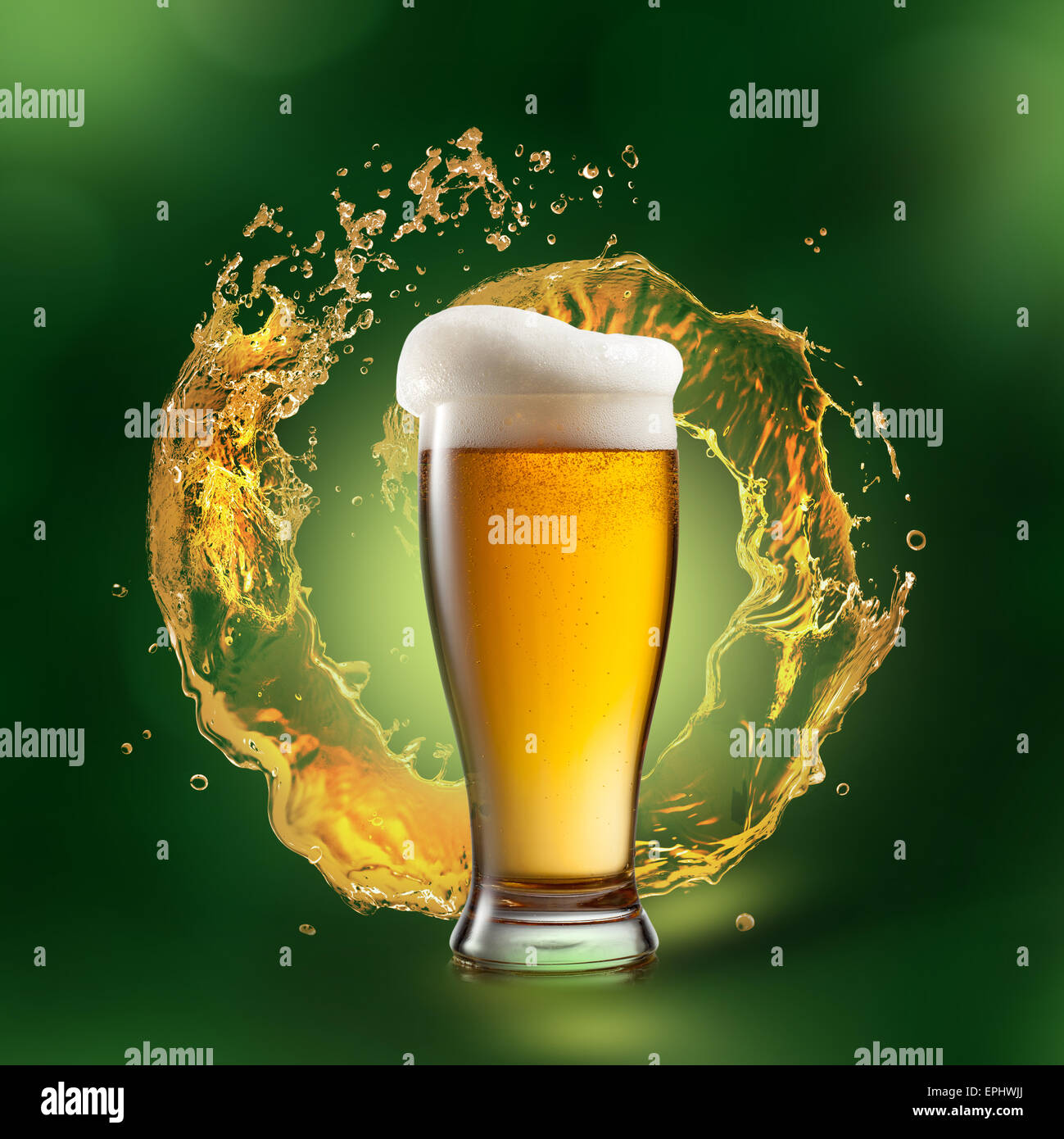 Beer in glass with splash on green background Stock Photo - Alamy