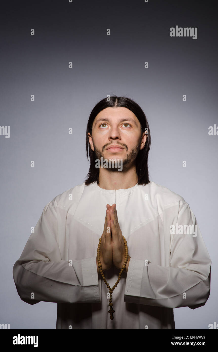 Priest man in religious concept Stock Photo - Alamy