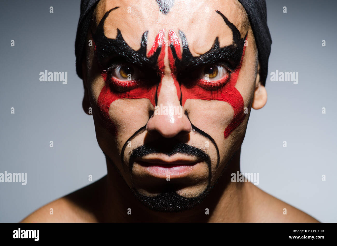 Man with face covered with facepaint Stock Photo - Alamy