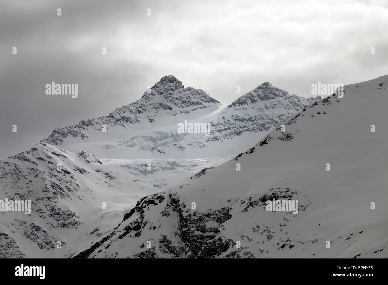 Snow peaks in cloudy hi-res stock photography and images - Alamy