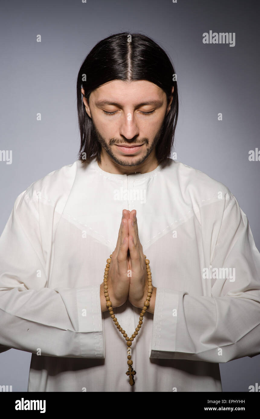 Priest man in religious concept Stock Photo - Alamy