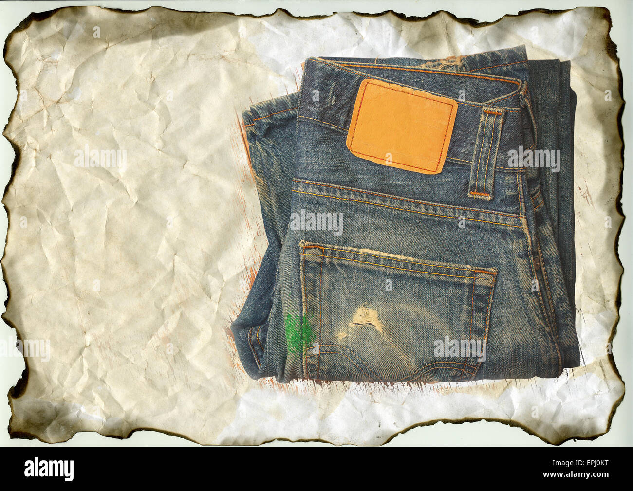 aged jeans on old paper Stock Photo - Alamy